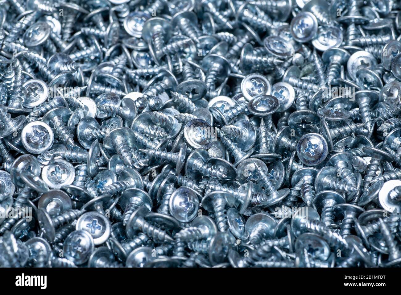 Metal screws and fasteners background. Metal products for construction ...