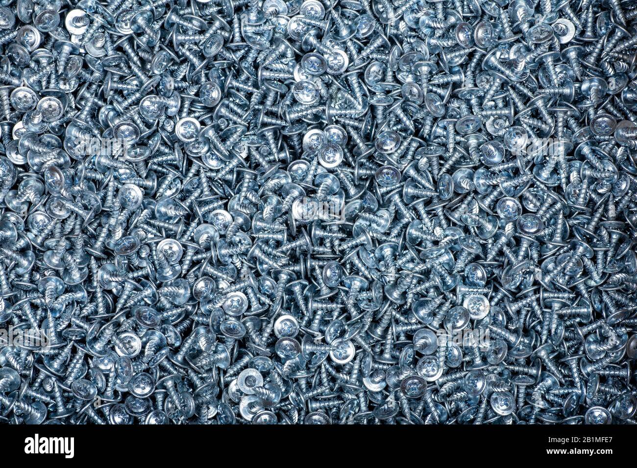Metal screws and fasteners background. Metal products for construction ...