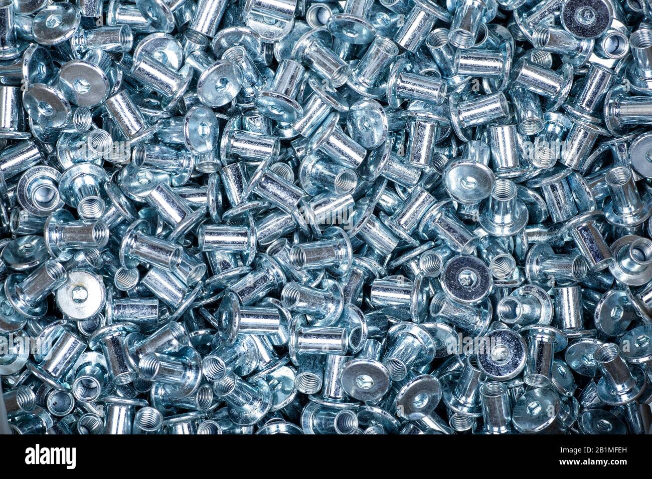 Metal screws and fasteners background. Metal products for construction ...
