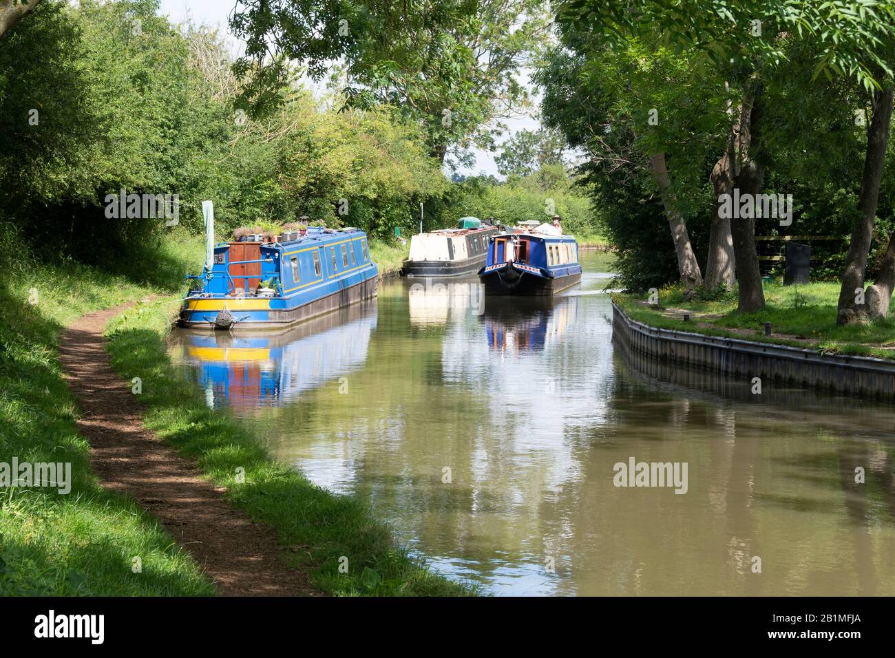 Canal boat travelling along the Oxford canal at Braunston ...