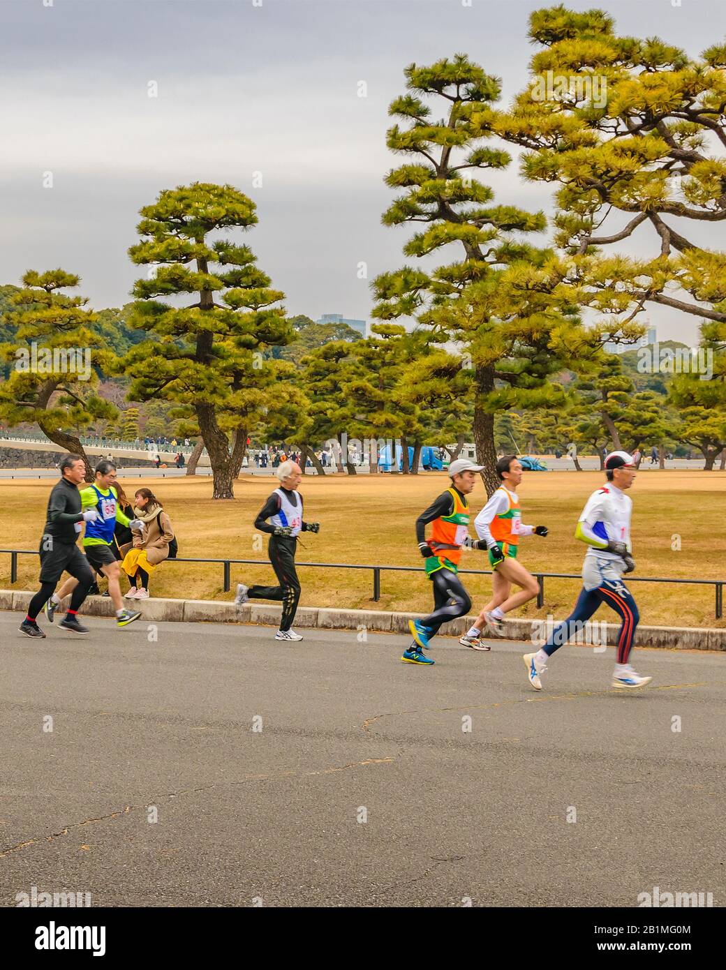 TOKYO, JAPAN, JANUARY - 2019 - People running at exterior imperial ...