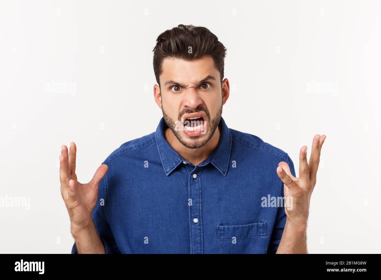 young office worker mad by stress screaming isolated on white Stock ...