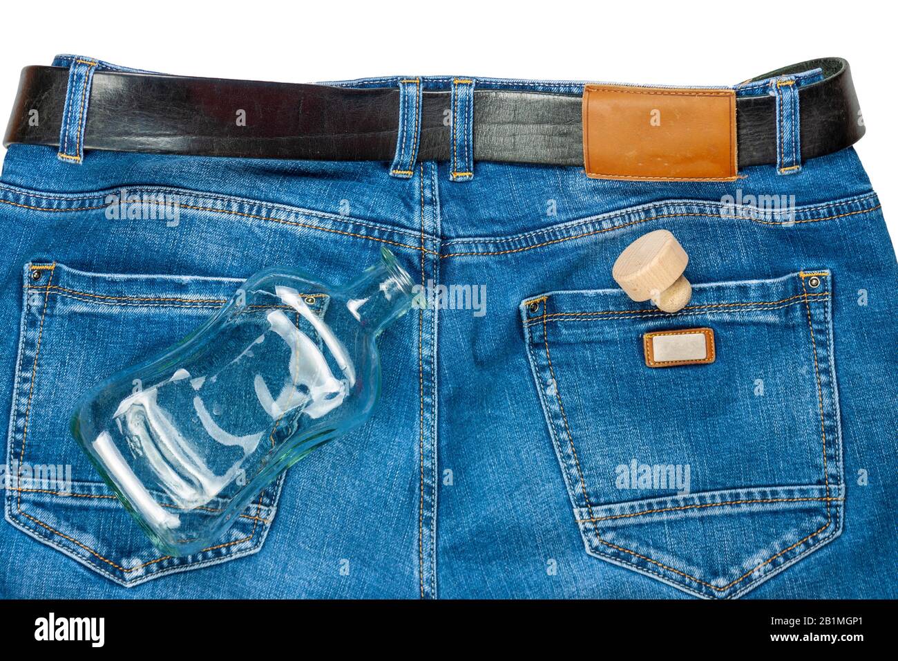On the jeans is an empty glass bottle with a cork Stock Photo - Alamy