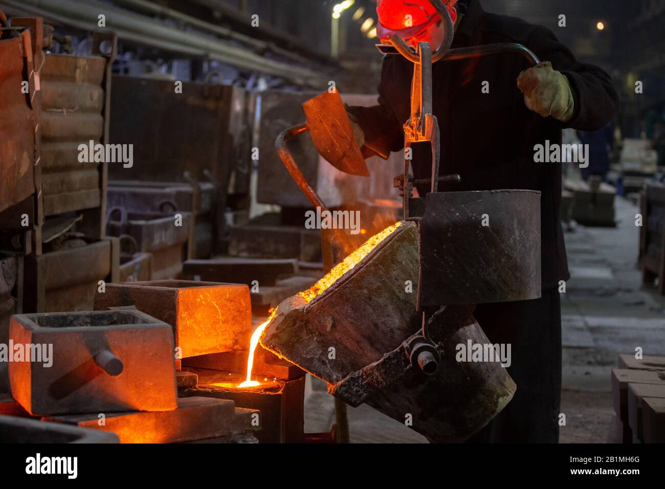 Industrial chill casting. The process of for filling out mold with ...