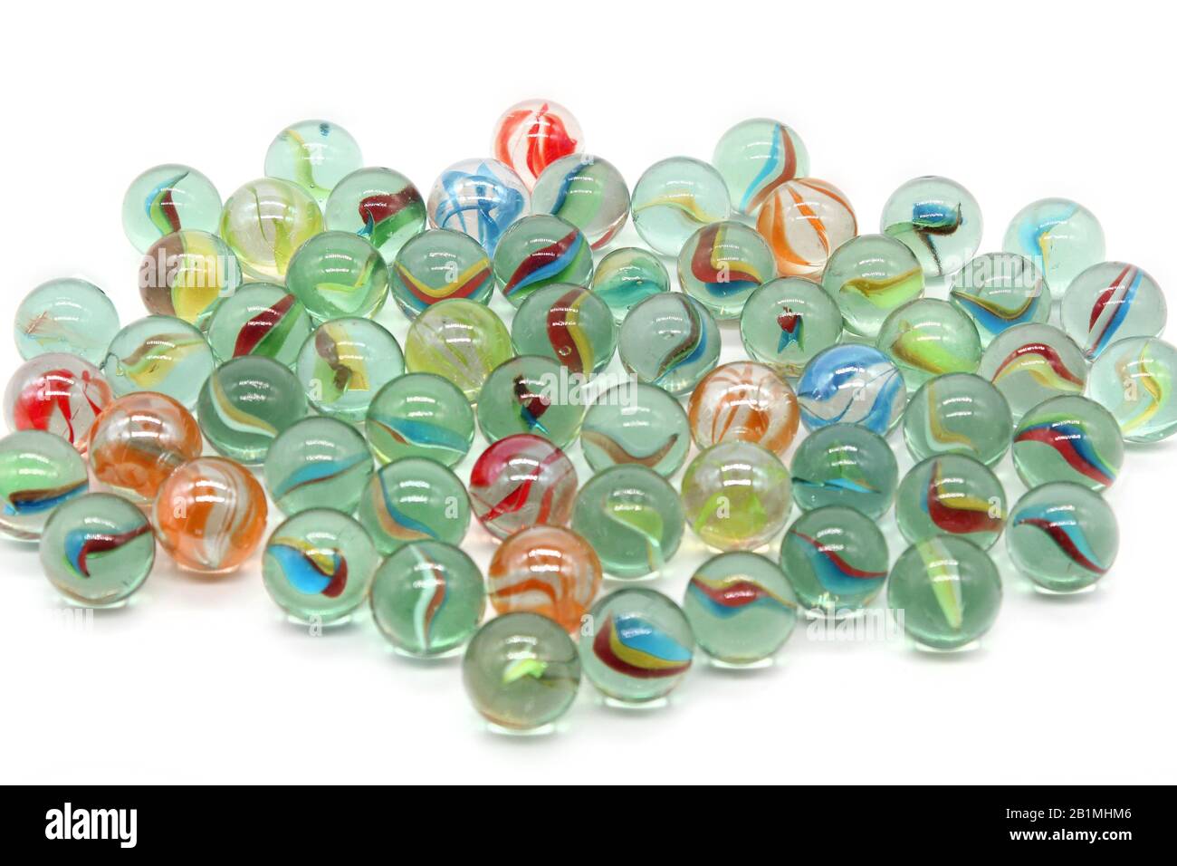 Glass marbles, isolated on white background, close-up Stock Photo - Alamy