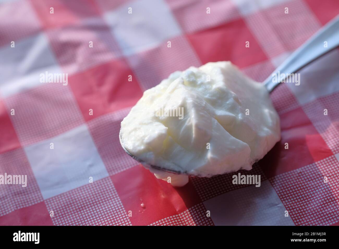 Yogurt with spoon hi-res stock photography and images - Alamy