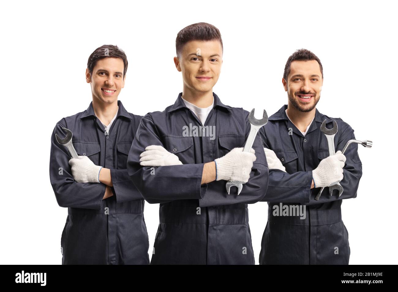 Group of male workers in uniforms with tools isolated on white ...