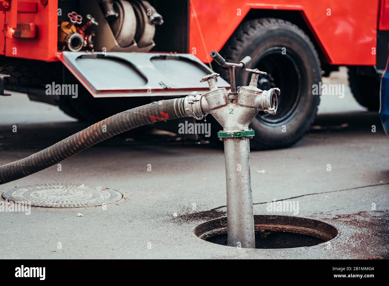 Fire hydrant in use during a structure fire hi-res stock photography ...
