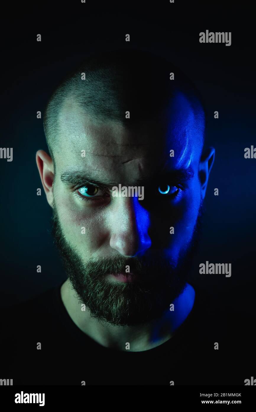 Portrait of a werewolf guy, close-up of a face with a scar on his face ...