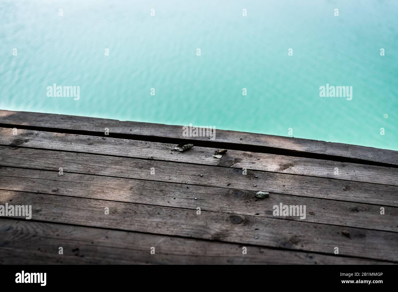 Rustic wooden dock pier and blue lake, text space Stock Photo - Alamy