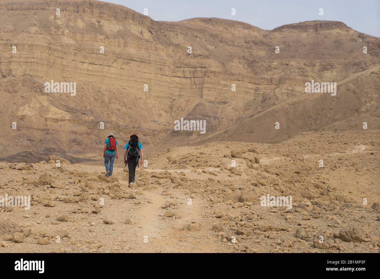 Israel travel trek in desert backpackers tourism Stock Photo - Alamy