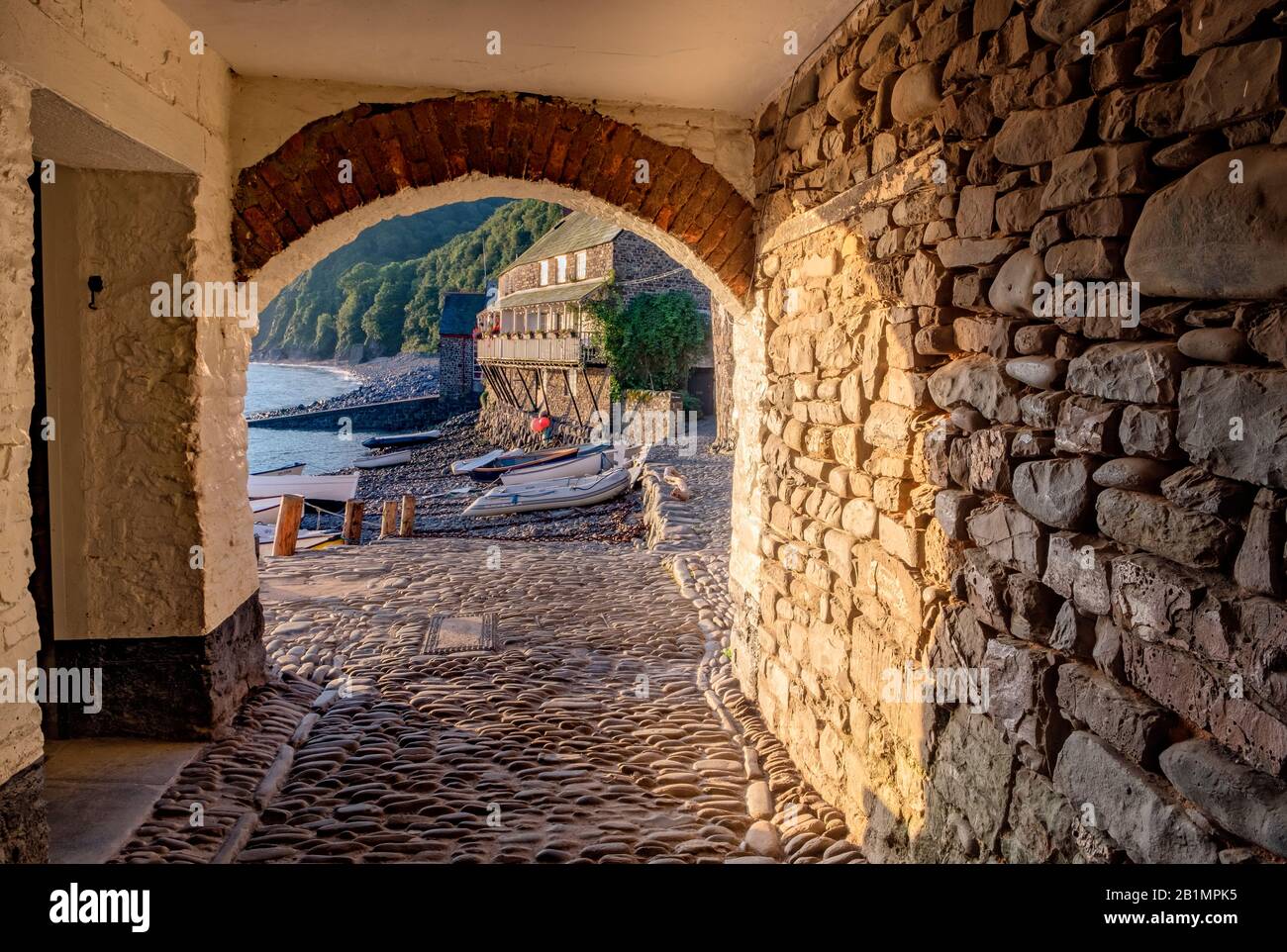 Archway at Clovelly fishing village, showing the buildings, boats and ...
