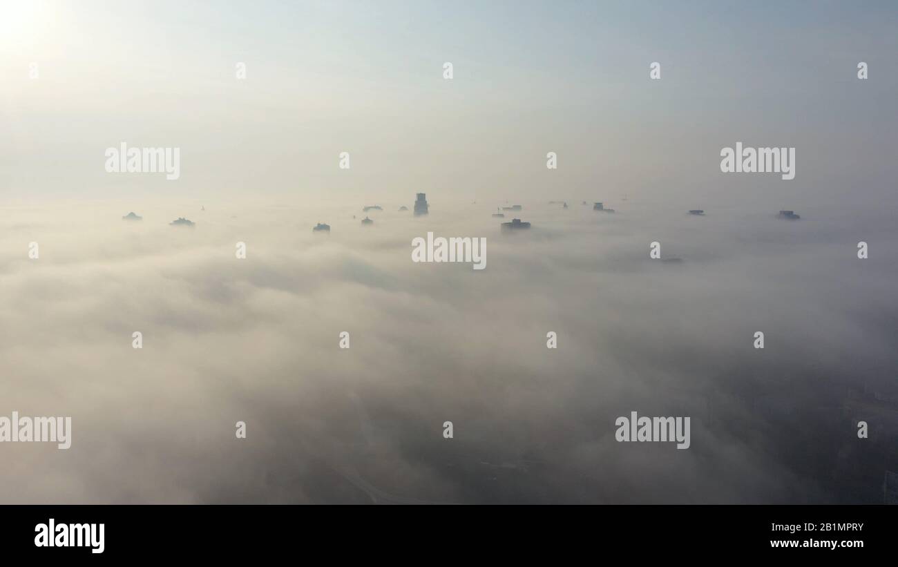 Aerial view of the city in the fog. Skyscrapers above the fog Stock ...