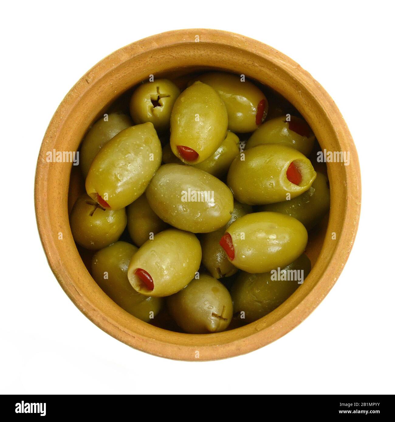 Olives in a clay bowl, isolated on white background Stock Photo - Alamy