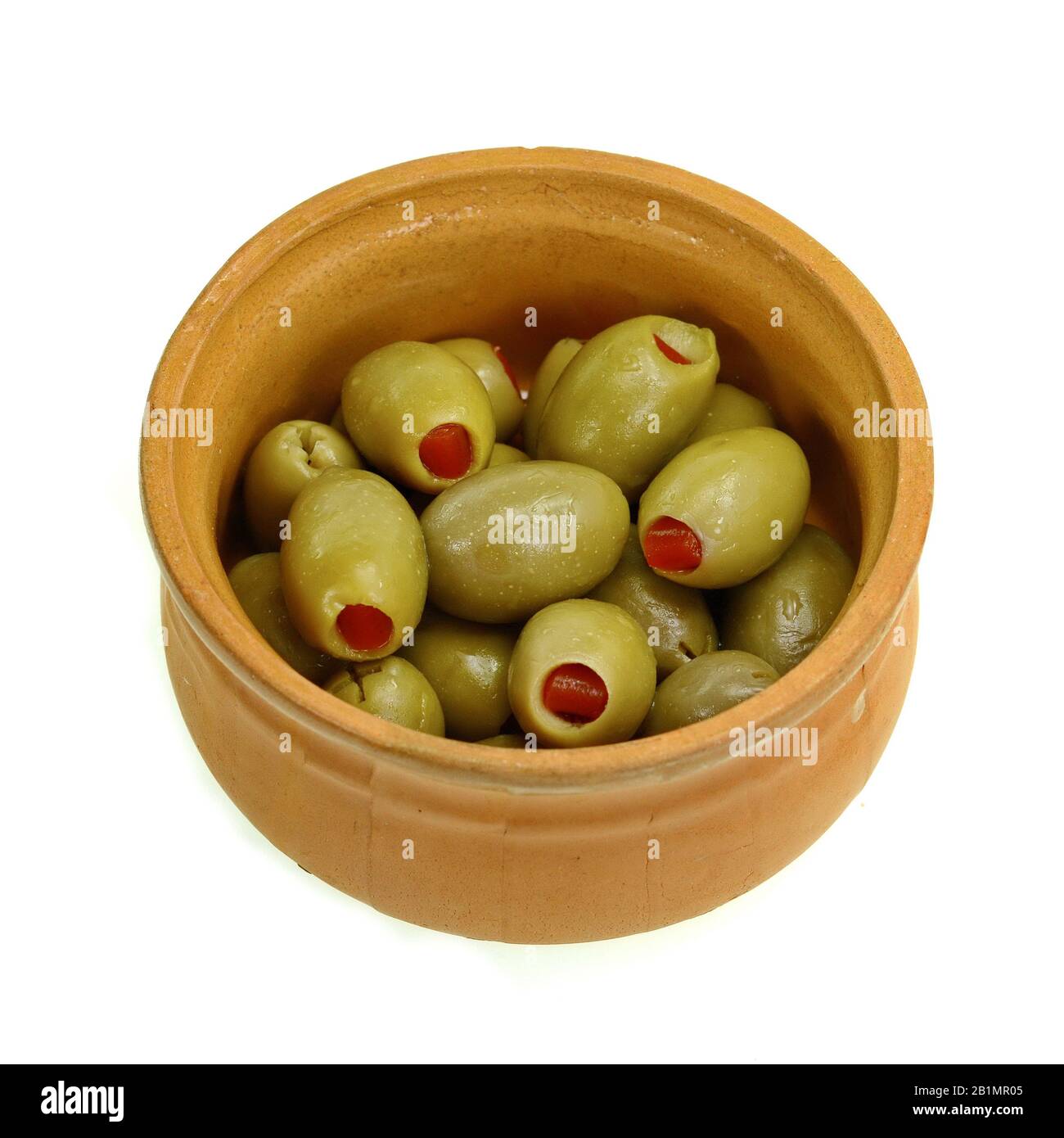 Olives in a clay bowl, isolated on white background Stock Photo - Alamy