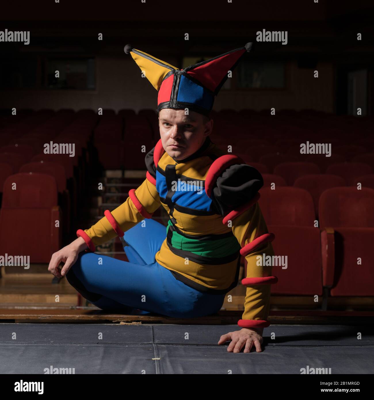 Actor dressed jester's costume in interior of old theater Stock Photo ...