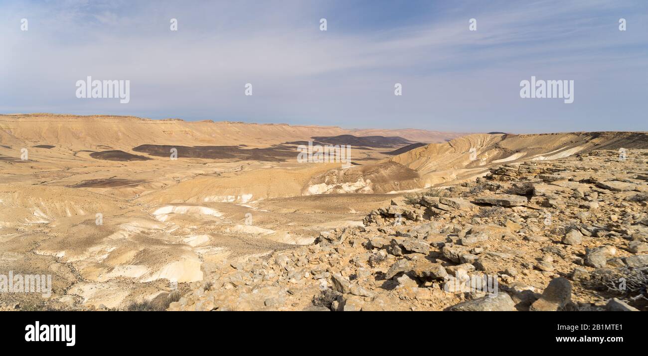 Travel and hiking in Israeli stone desert and crater Stock Photo - Alamy
