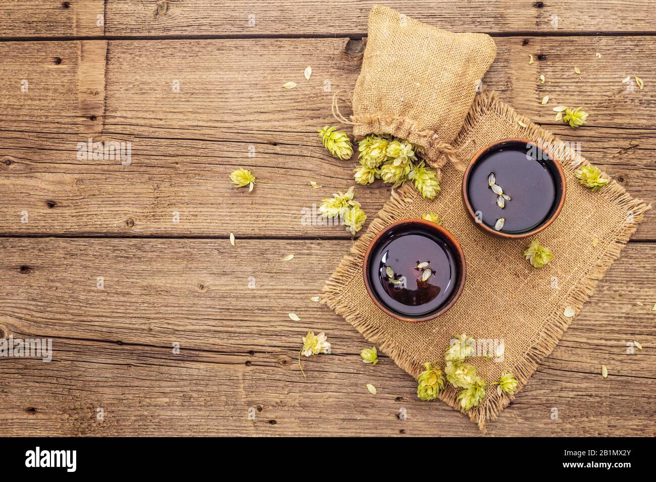 Cup of calming herbal tea with fresh wild hops. Brewery. Beer ...