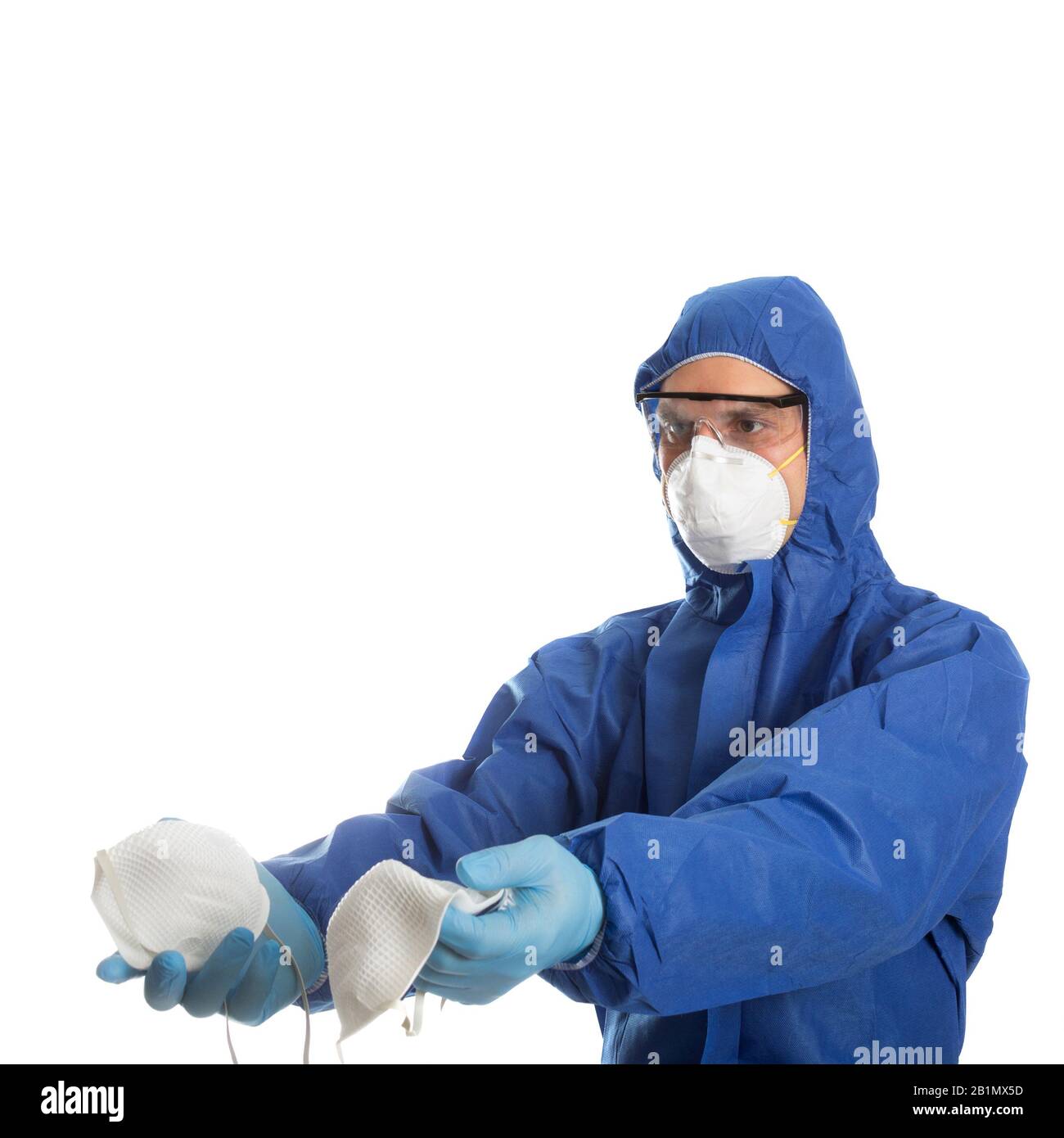 Man in protective clothing give face masks to someone. Coronavirus ...
