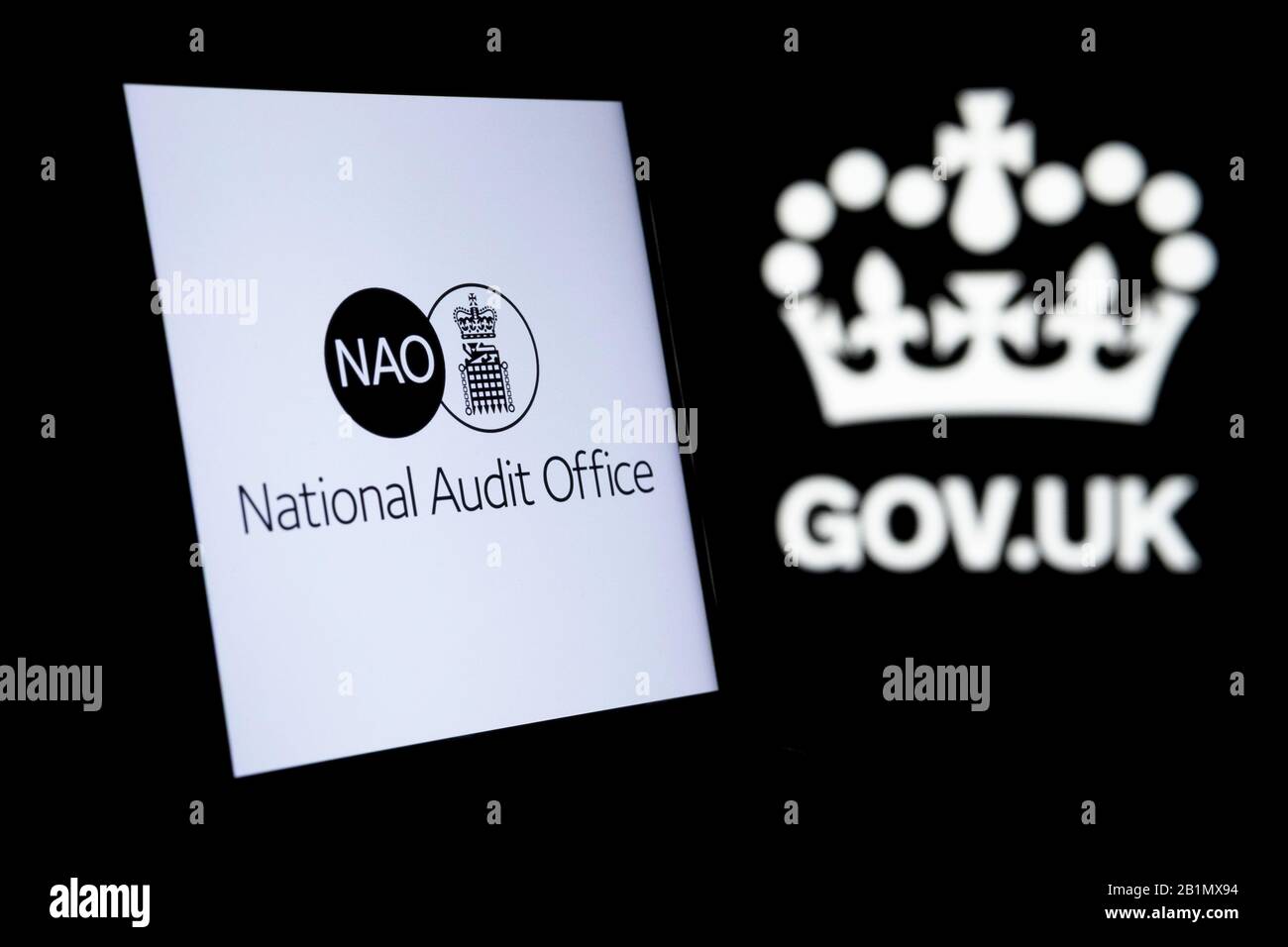 UK National Audit Office logo glowing on the smartphone screen and gov ...