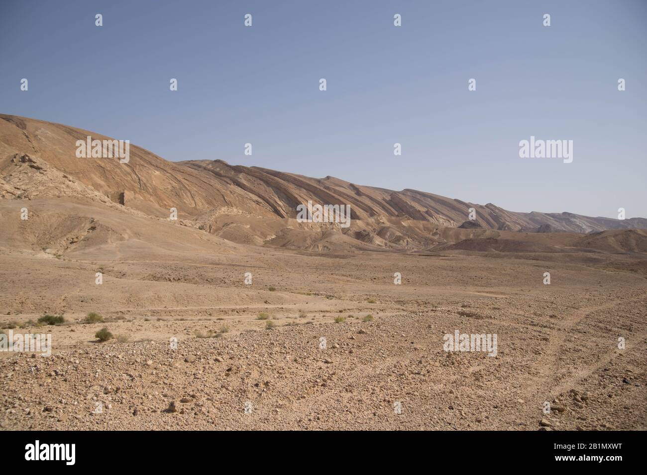 Hiking in stone desert mountain landscape of Israel Stock Photo - Alamy
