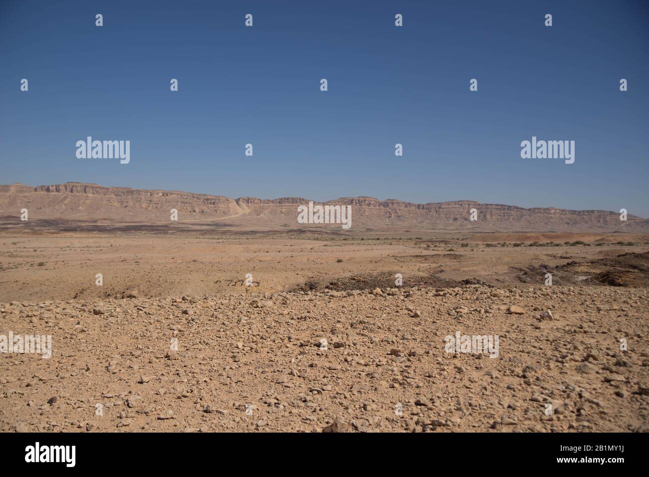 Hiking in stone desert mountain landscape of Israel Stock Photo - Alamy