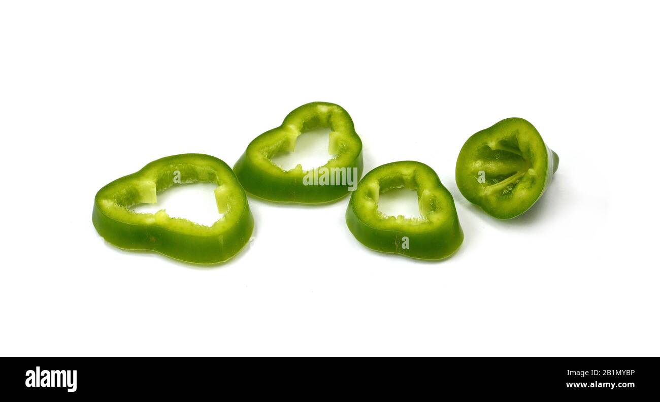 Sliced fresh green paprika isolated on white background Stock Photo - Alamy