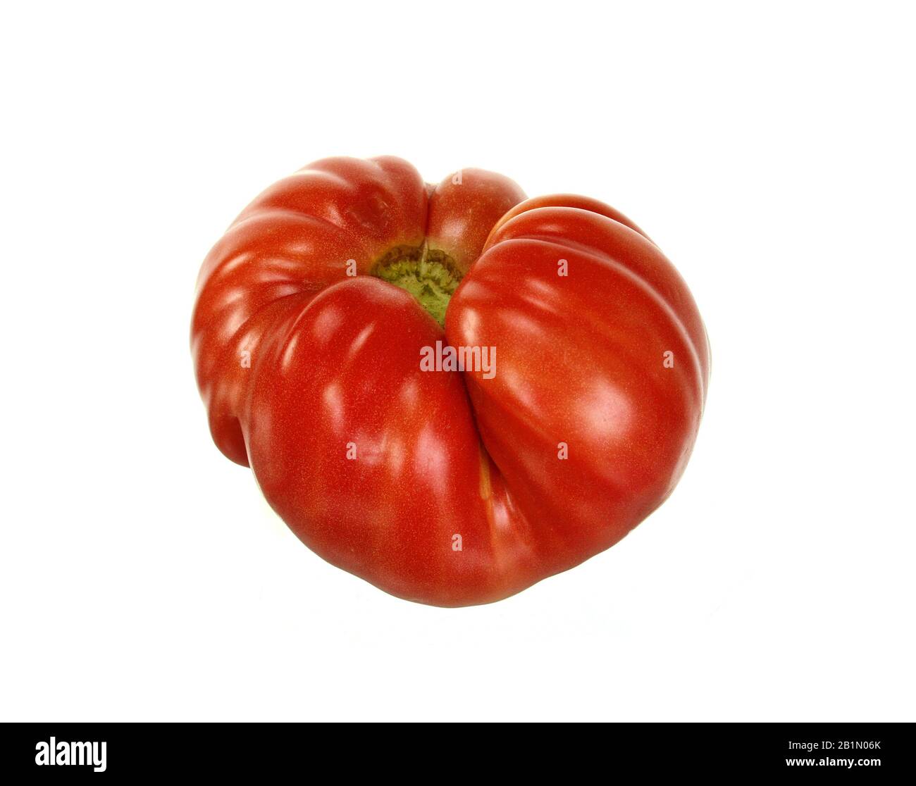 Strange shape fresh tomato isolated on white background Stock Photo - Alamy