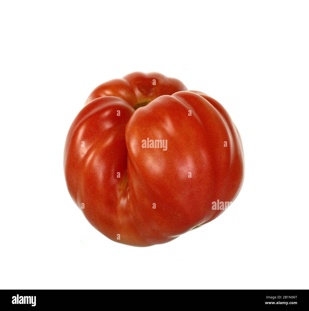 Strange shape fresh tomato isolated on white background Stock Photo - Alamy