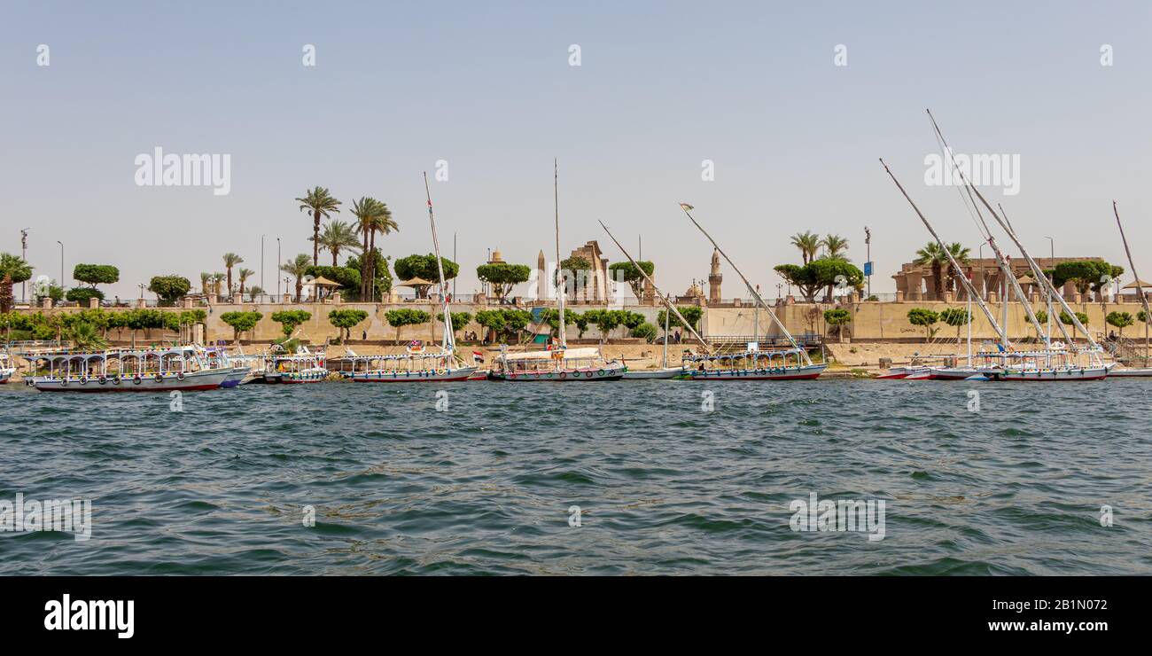 Luxor, Egypt - April 16, 2019: Tourist riverboats with national flags ...