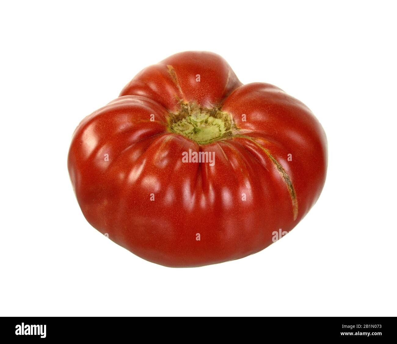 Strange shape fresh tomato isolated on white background Stock Photo - Alamy