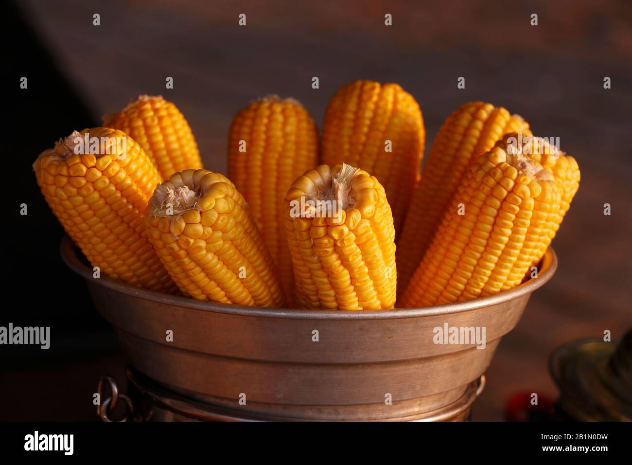 Composition with fresh corn cobs on tray Stock Photo - Alamy