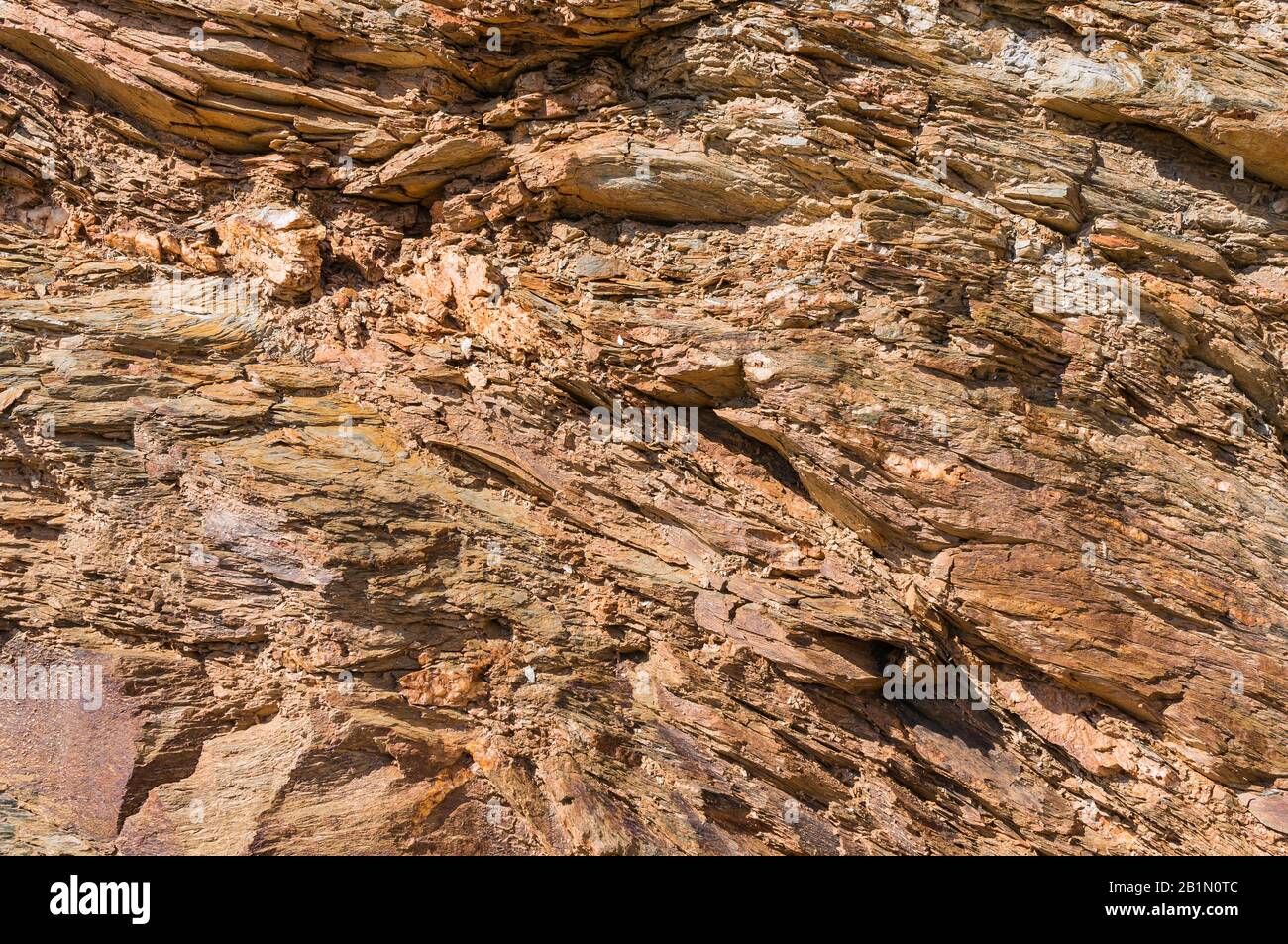 Natural background of brown layered sandstone. Rock on the seashore ...