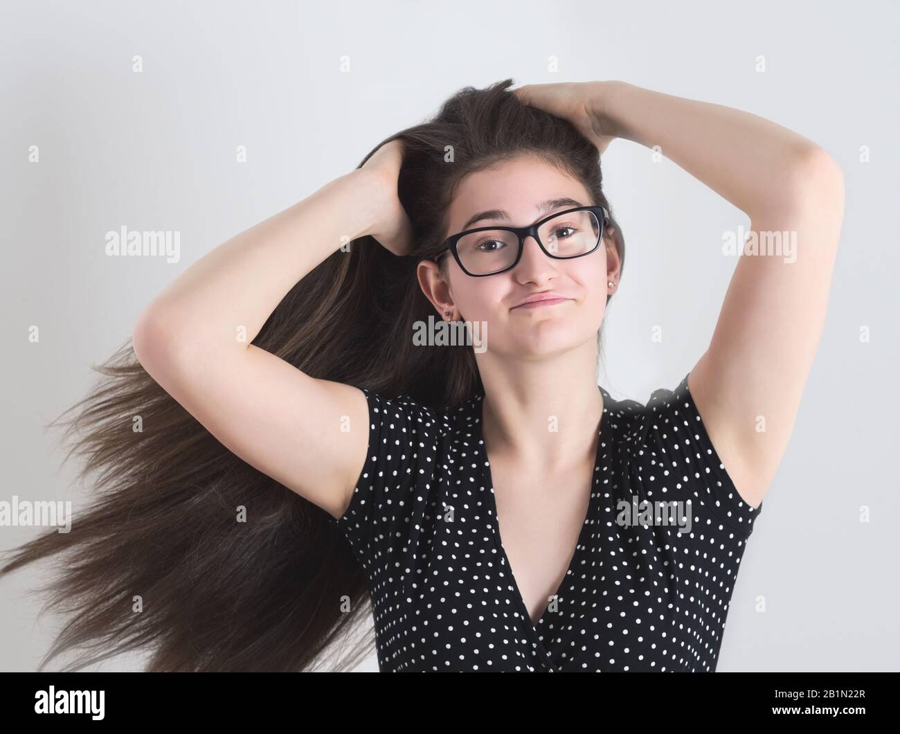 Portrait of a Dancing Bespectacled Long-haired Brunette Teen Girl Stock ...