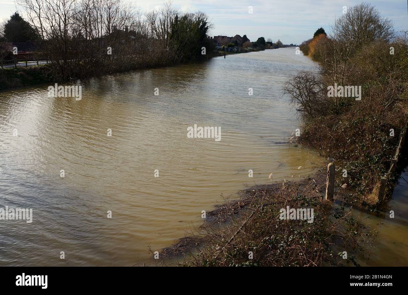 Nearly overflowing, the forty-foot drain with muddy water drained off ...