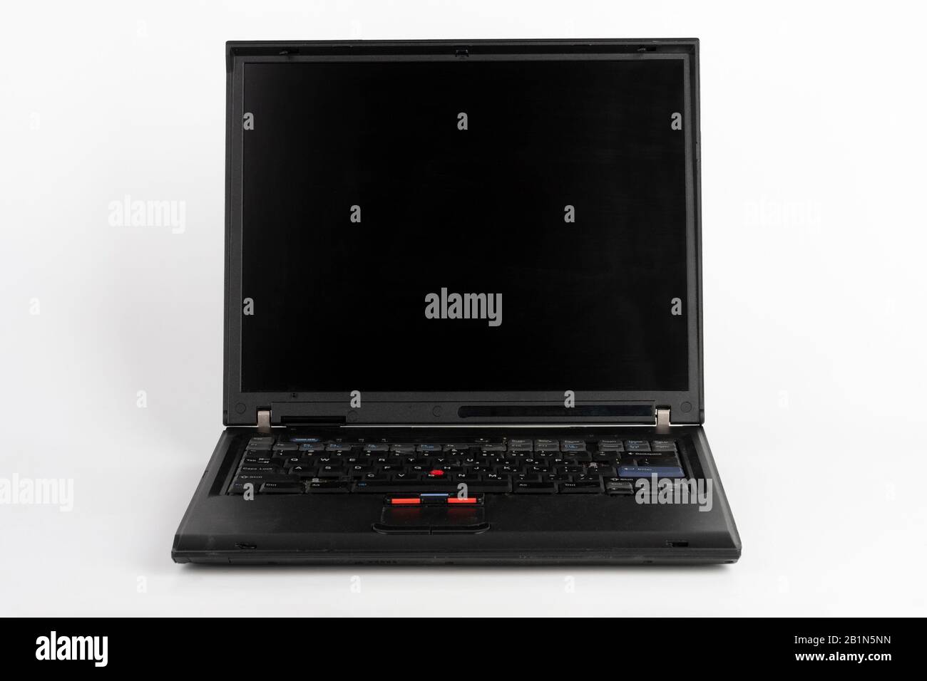 Old laptop on white background, which was produced in 2005, outer cover ...