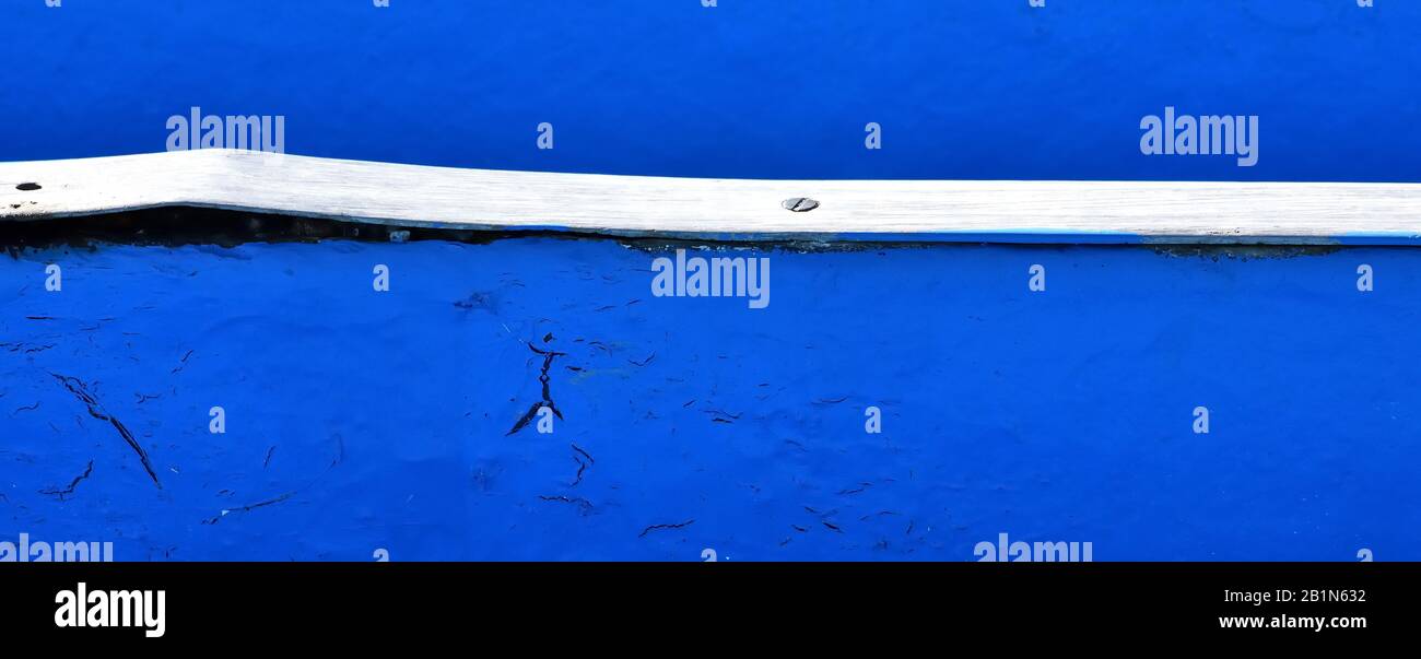 Wooden hull made of classic blue painted fishing boat with a screwed ...