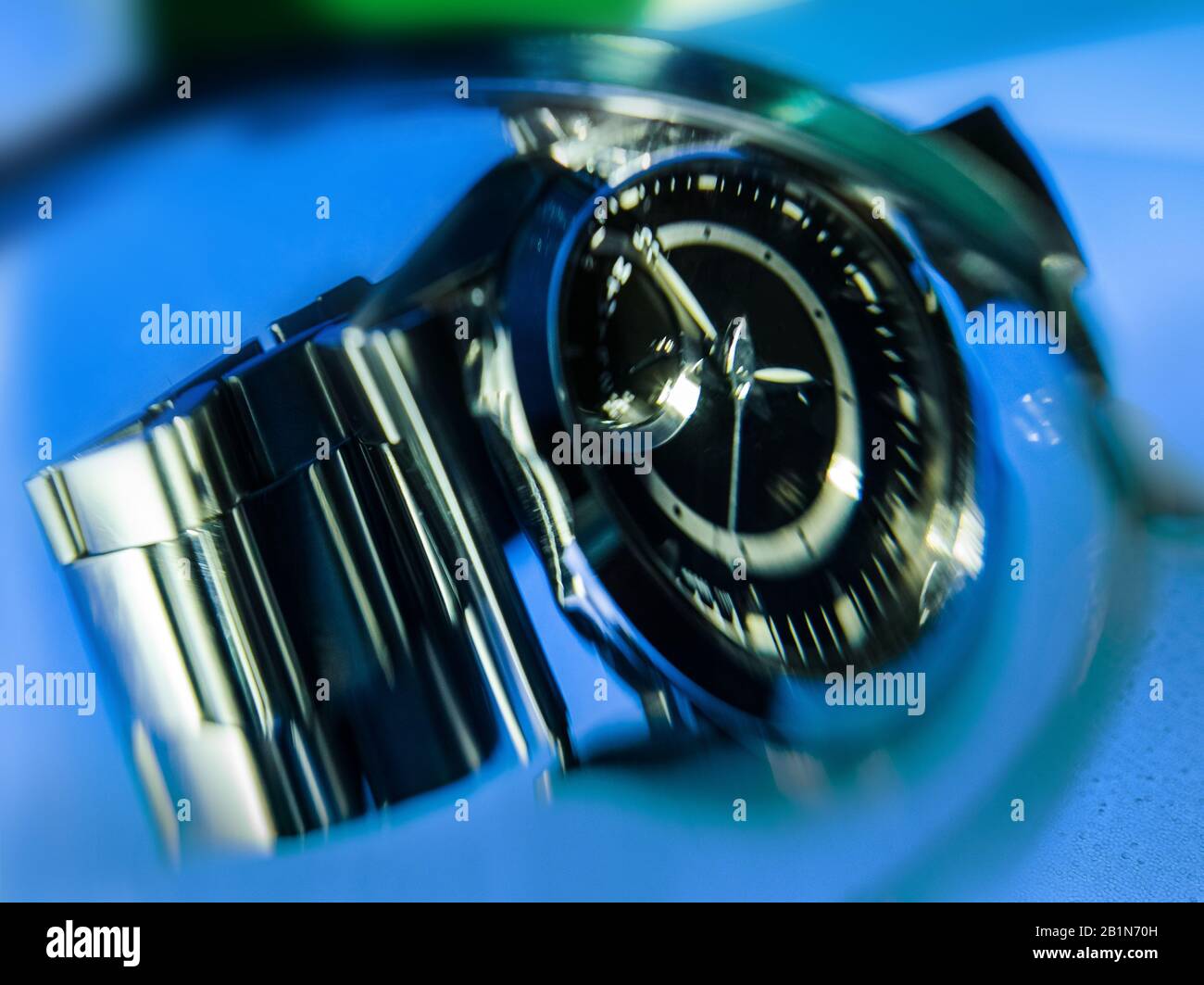 A stainless steel bracelet watch for men seen in close-up with optical ...
