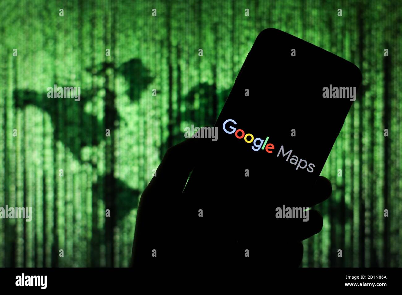 Google Maps Logo Seen Displayed On Smart Phone Screen With Matrix like 
