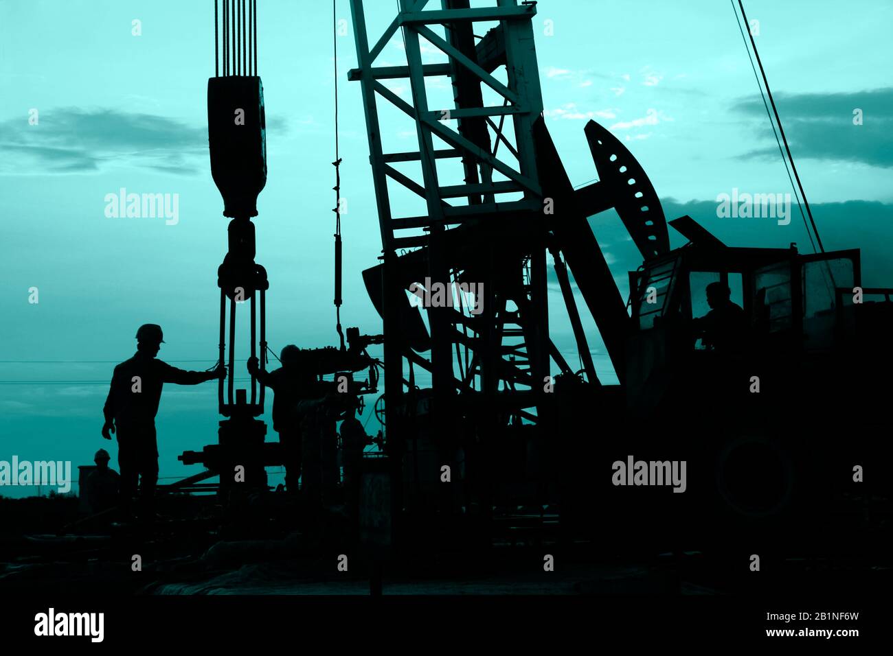 oil field, the oil workers are working Stock Photo - Alamy