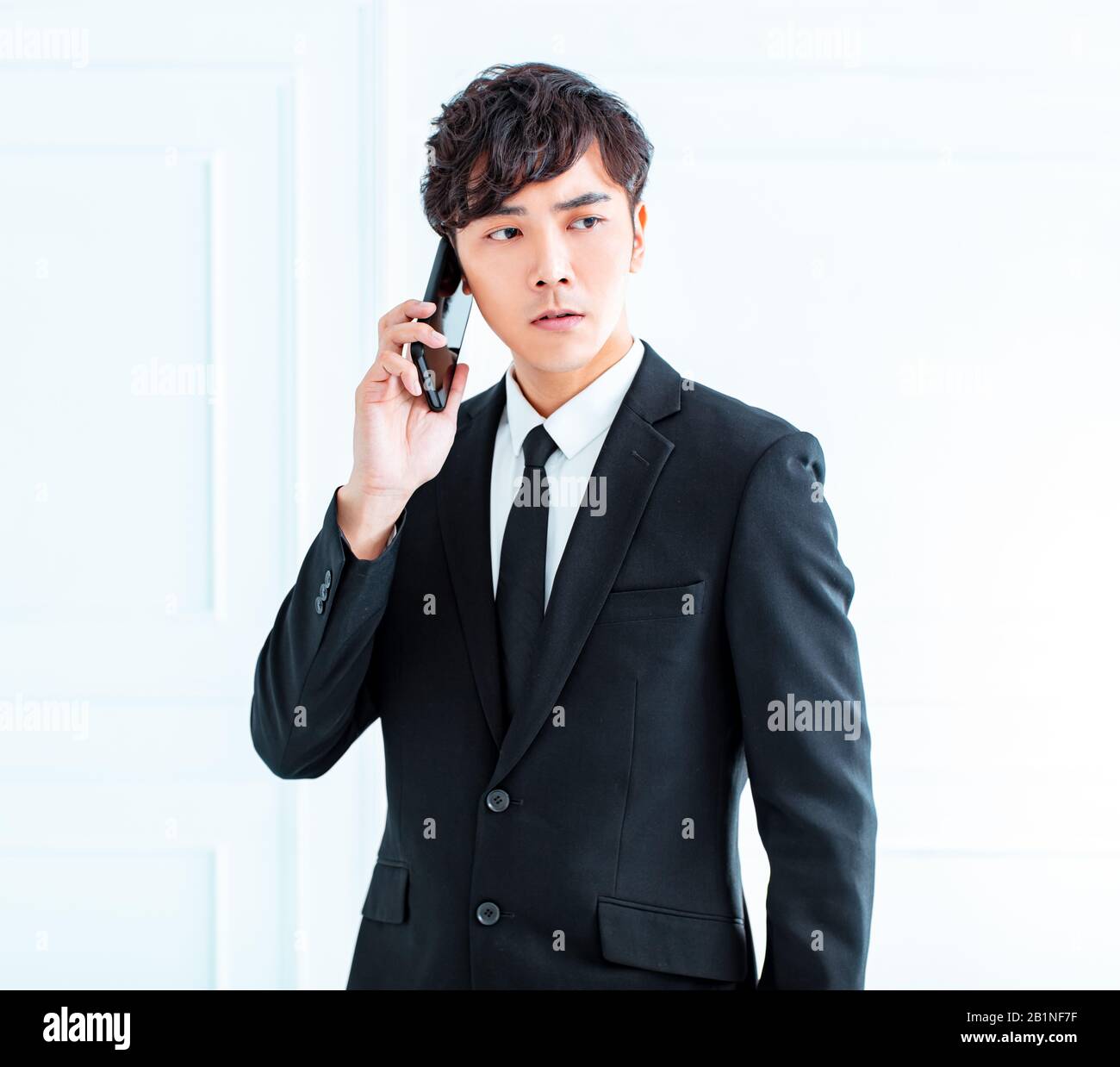 Cheerful young guy smartphone making hi-res stock photography and ...