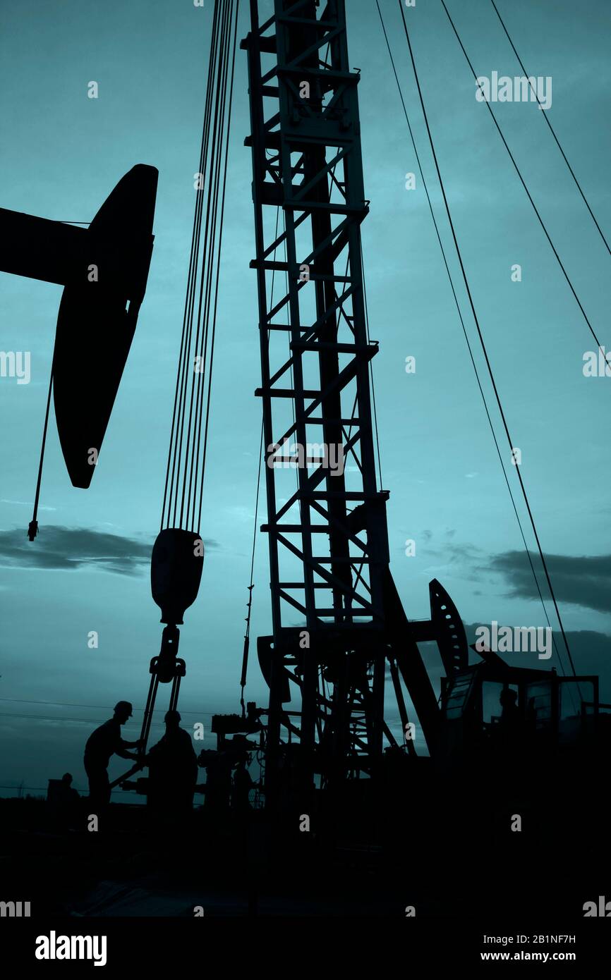 oil field, the oil workers are working Stock Photo - Alamy