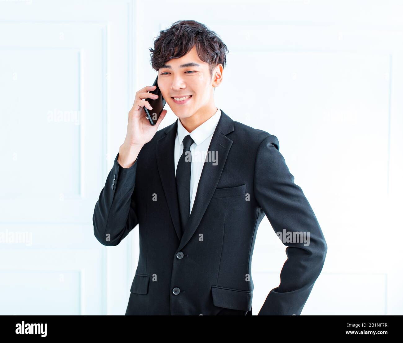 young Business man making phone call with smartphone Stock Photo - Alamy