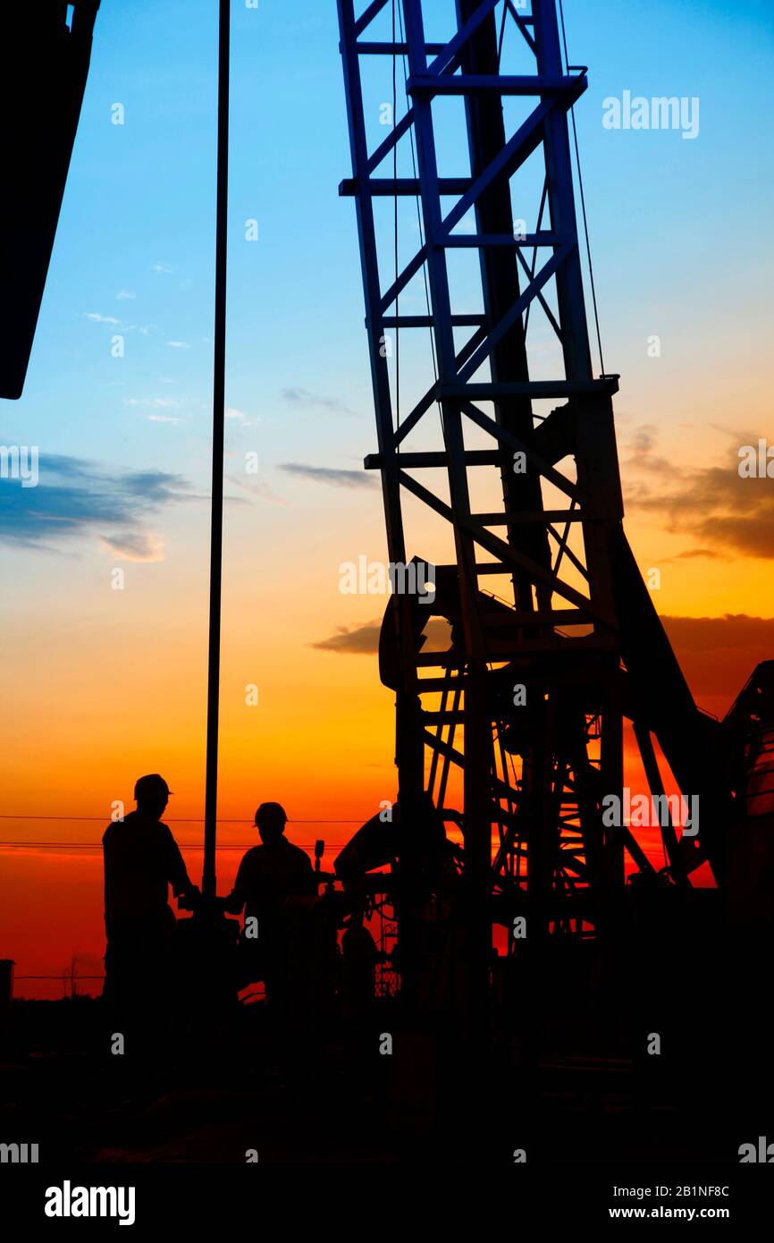oil field, the oil workers are working Stock Photo - Alamy
