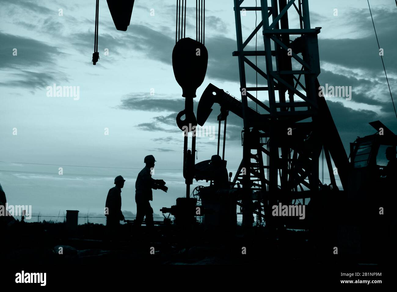oil field, the oil workers are working Stock Photo - Alamy