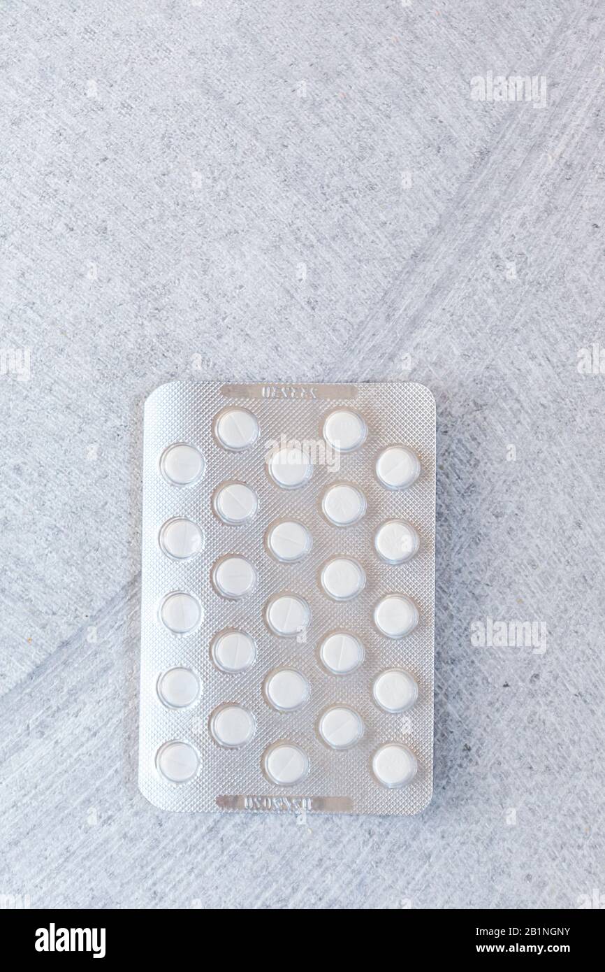 Tablets on the marble. Top view. vertical Stock Photo - Alamy