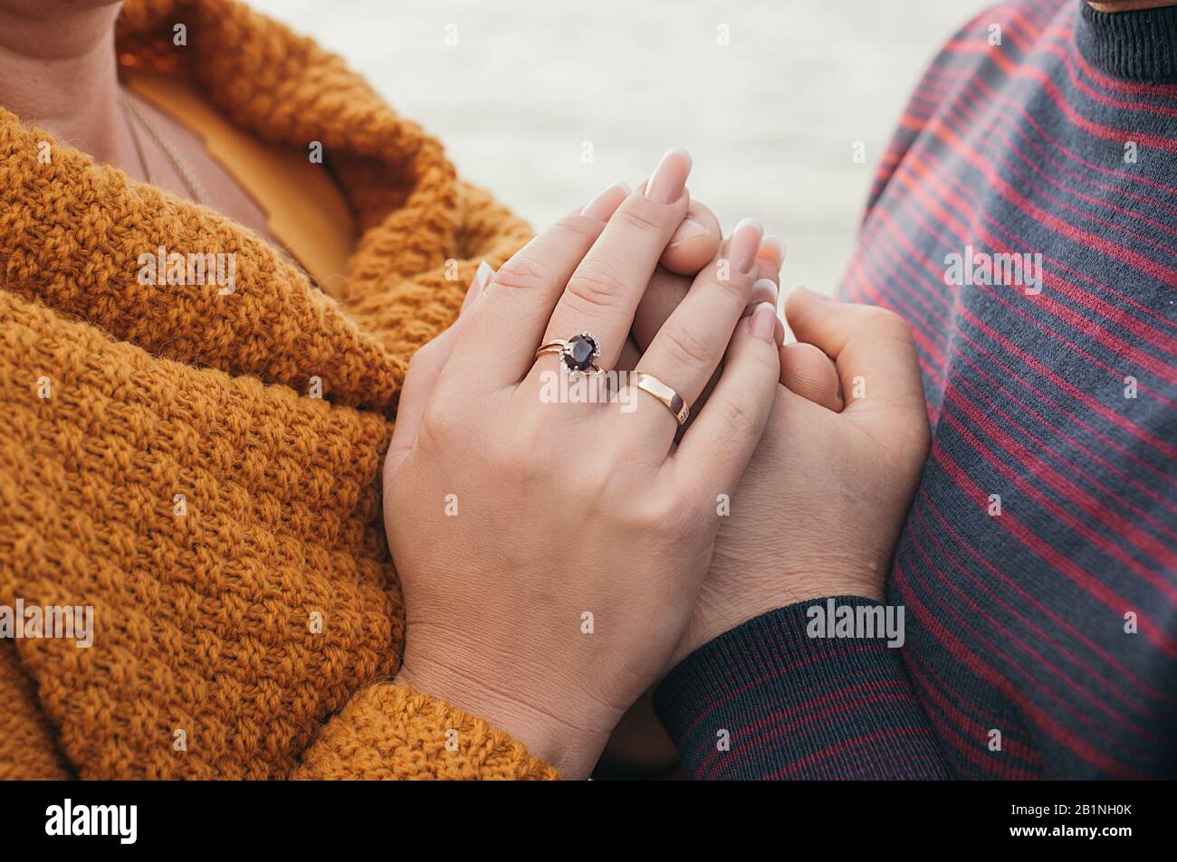 light-skinned heterosexual couple in knitted clothes without people ...