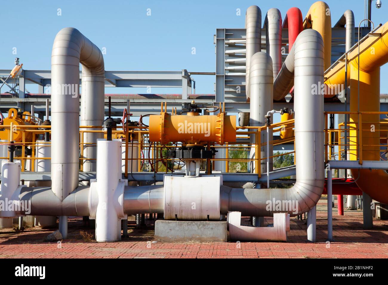 Oil field scene, oil pipelines and facilities Stock Photo - Alamy