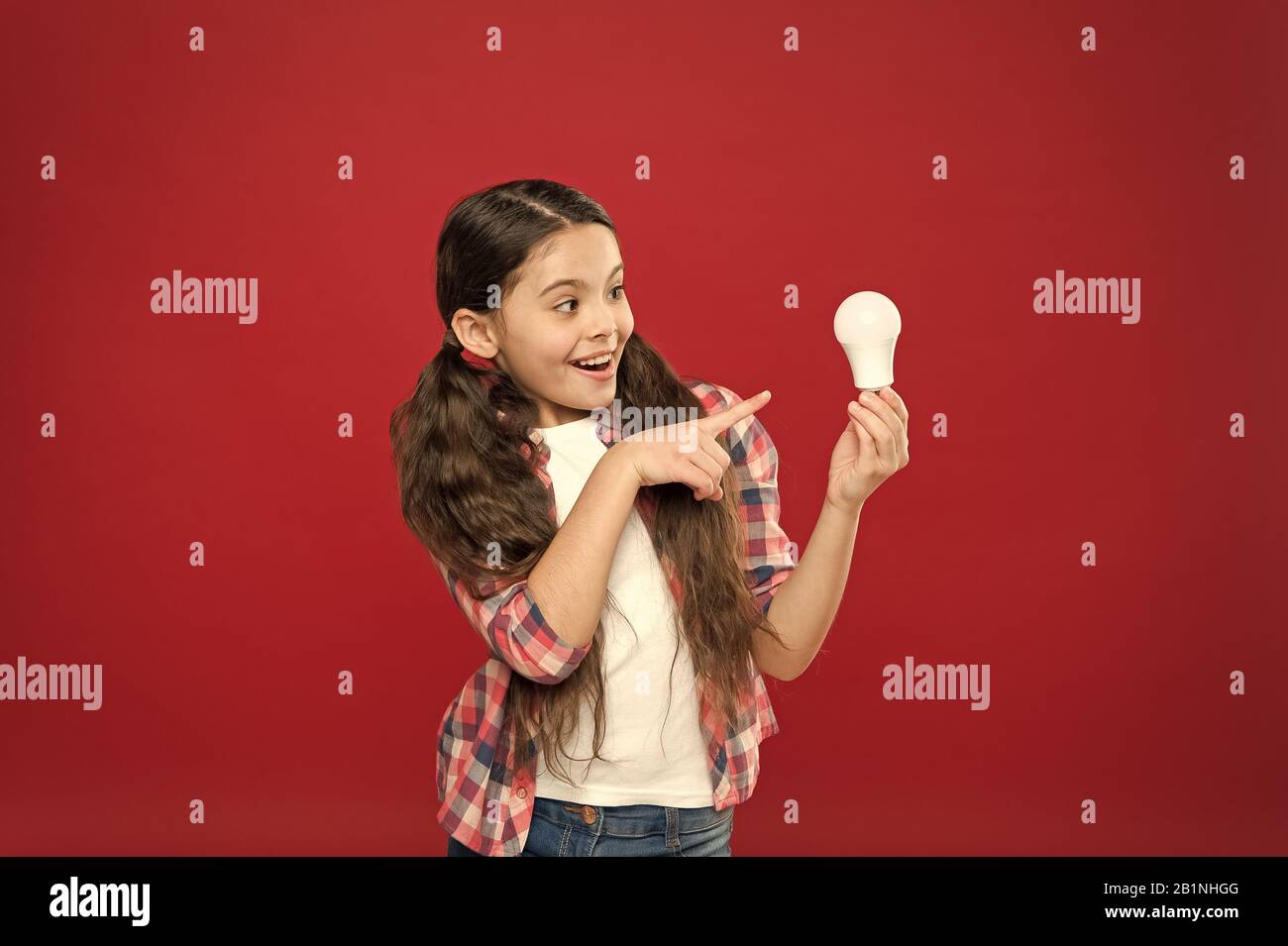 Fresh ideas. Electricity and energy. Little girl hold light bulb. Cute ...