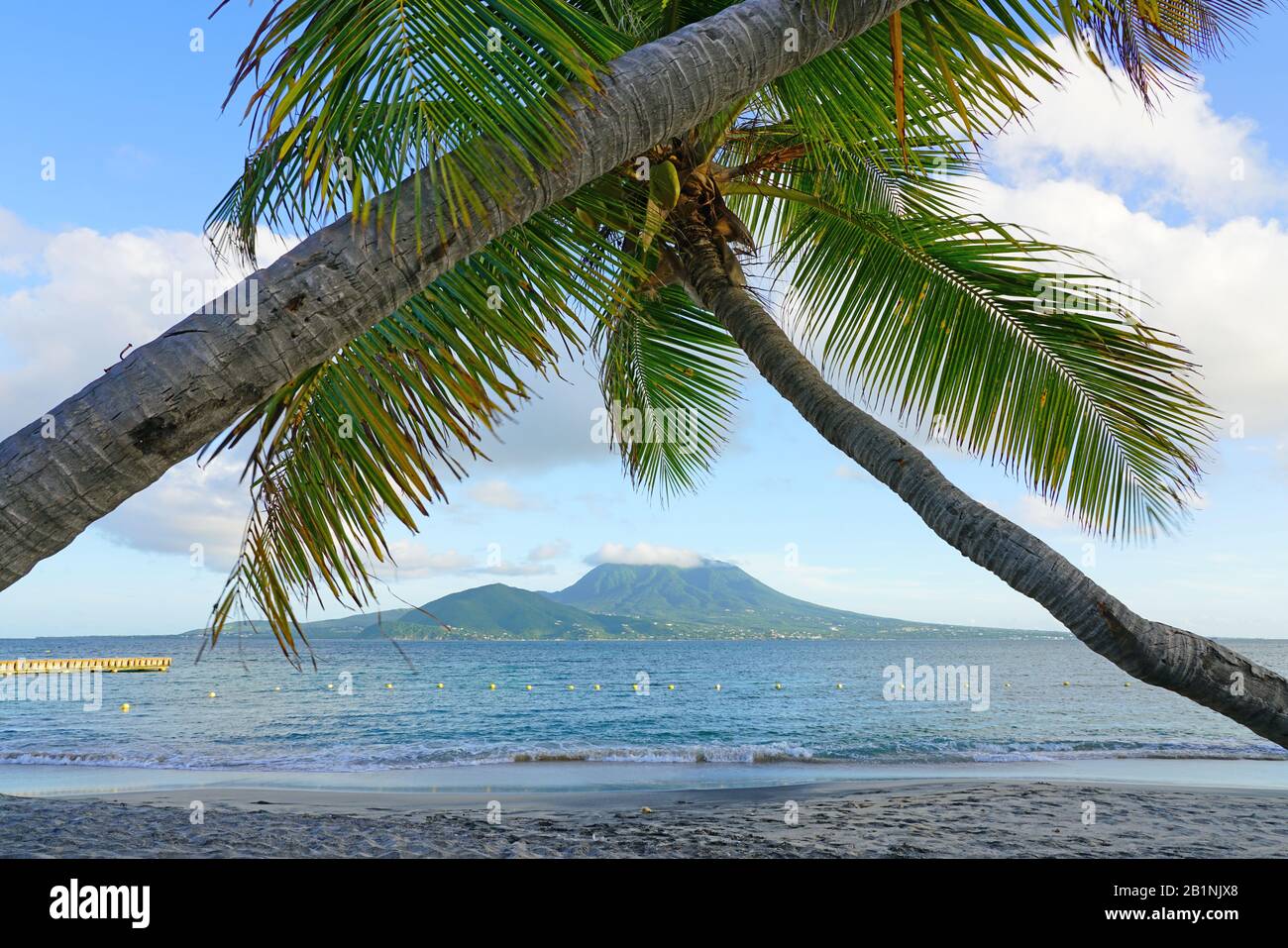 Day view of the Nevis Peak volcano across the water from St Kitts Stock ...